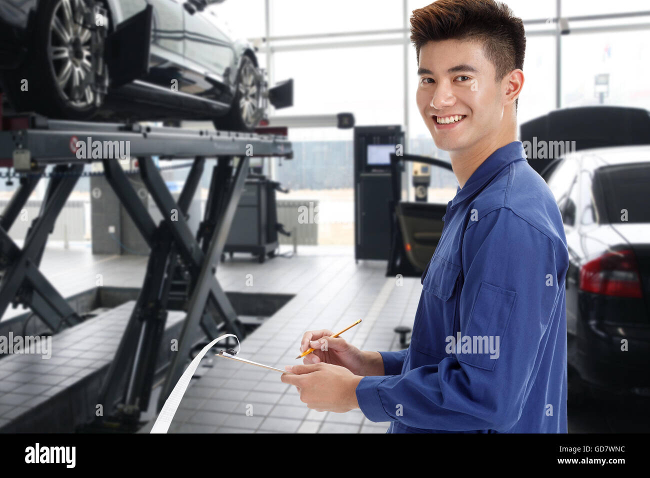 Car repair workers at work Stock Photo - Alamy