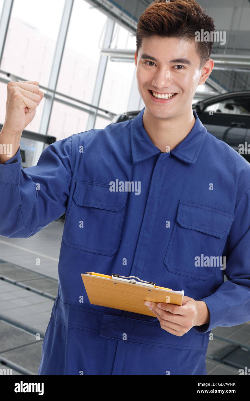 Car repair workers at work Stock Photo - Alamy