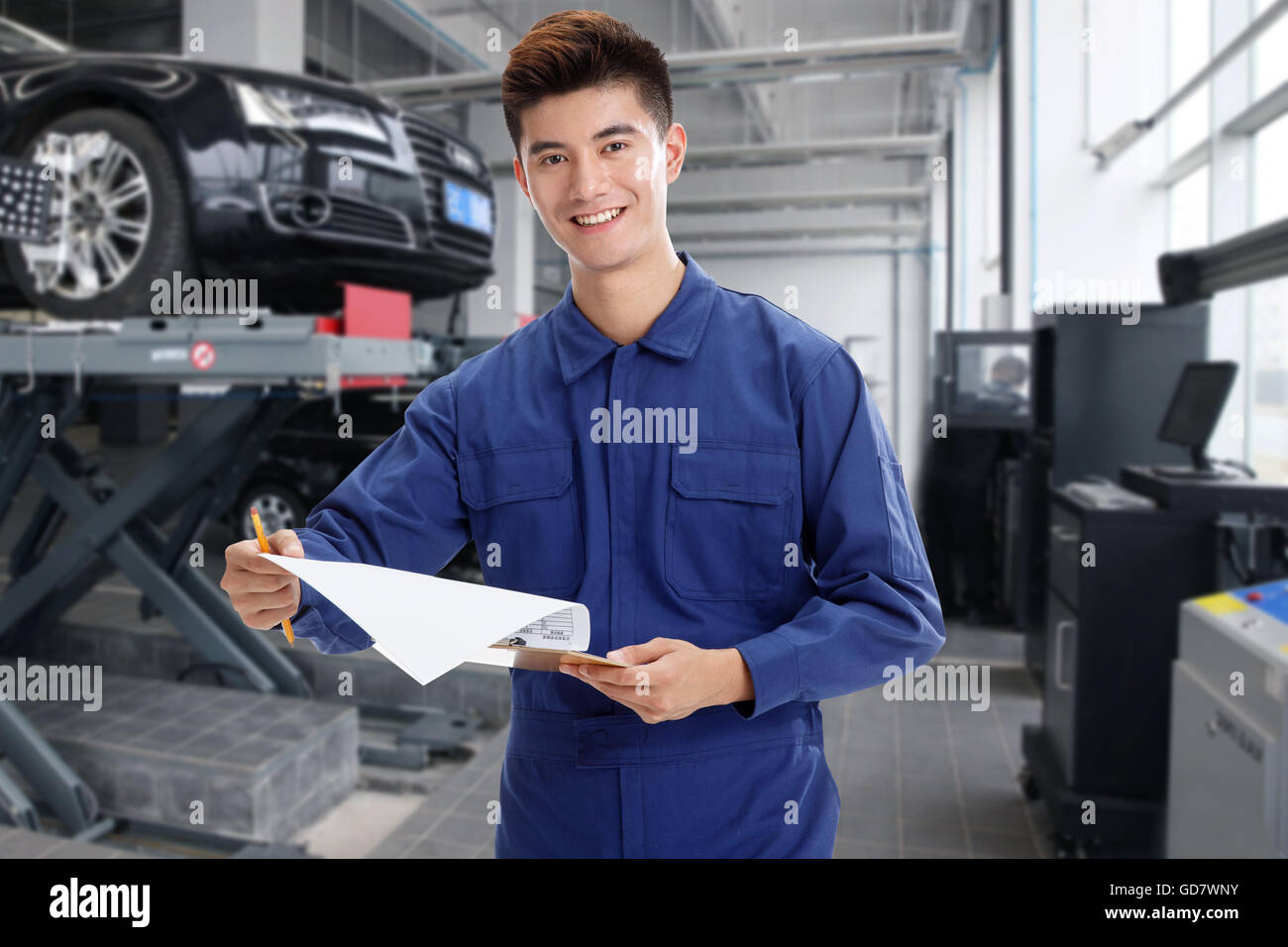 Car repair workers at work Stock Photo - Alamy