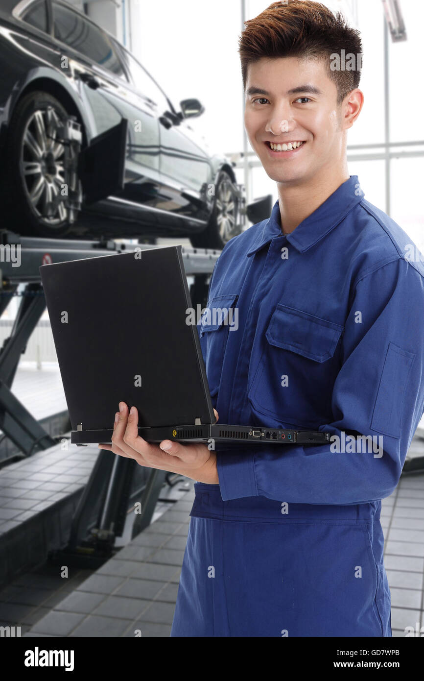 Car repair workers at work Stock Photo - Alamy
