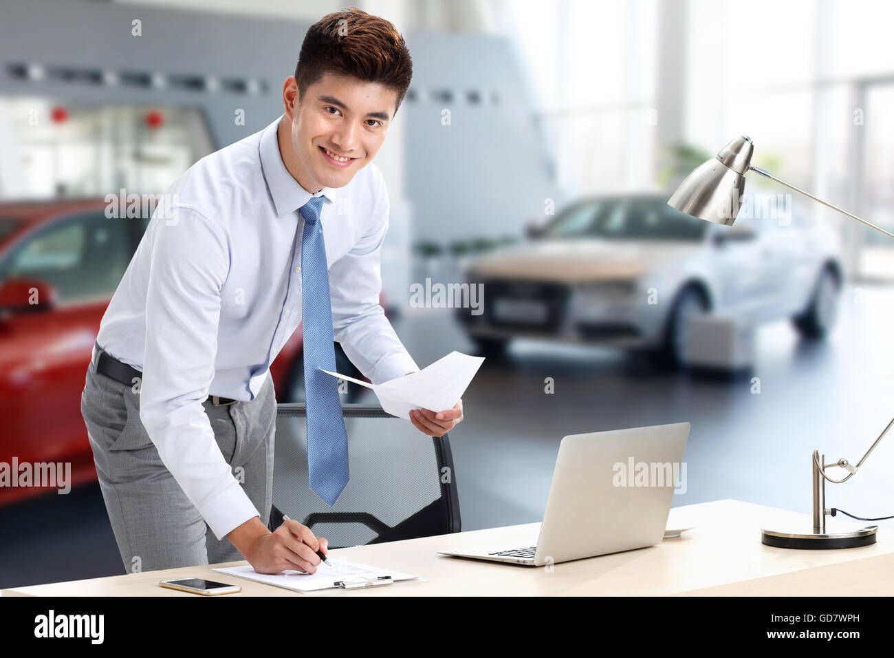 Receptionist in car dealership hi-res stock photography and images - Alamy