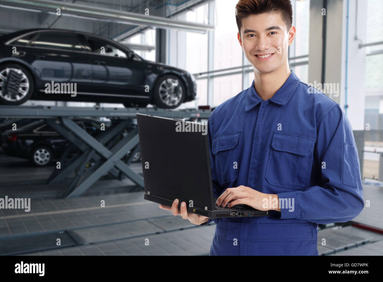 Car repair workers at work Stock Photo - Alamy