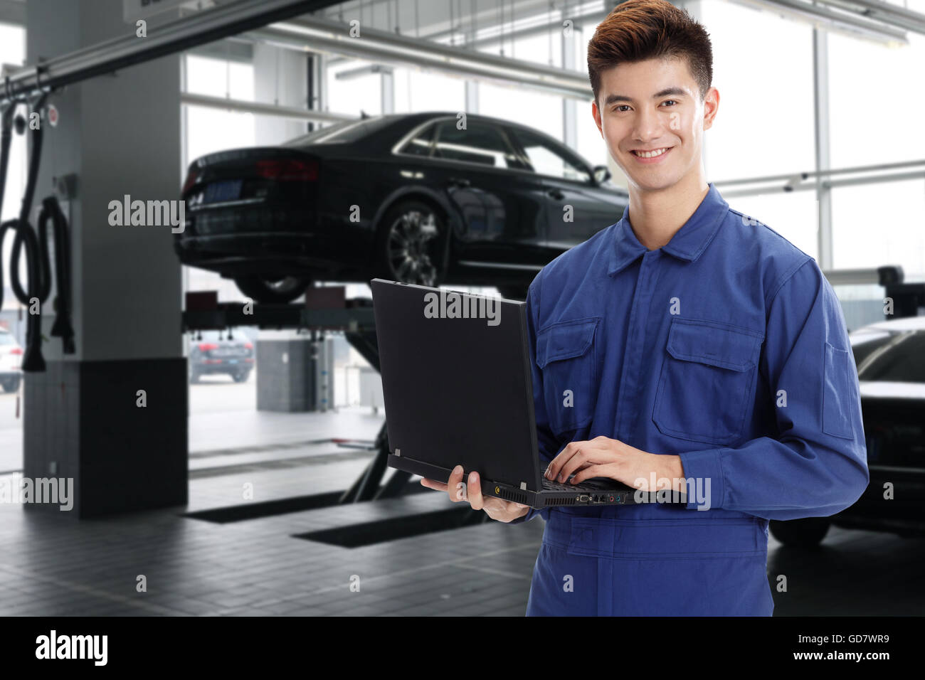 Car repair workers at work Stock Photo - Alamy