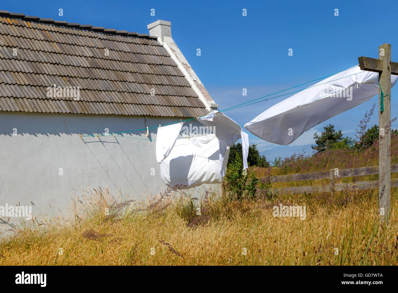 Clothes drying in the wind on a clothes line hi-res stock photography ...