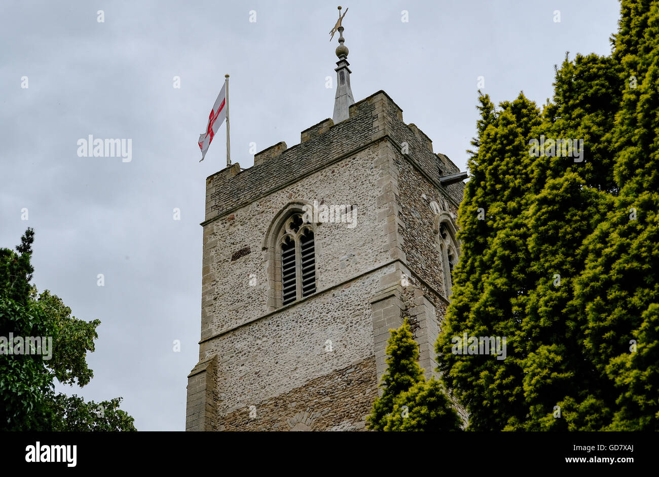 Classic view of an English church bell tower complete with the St ...