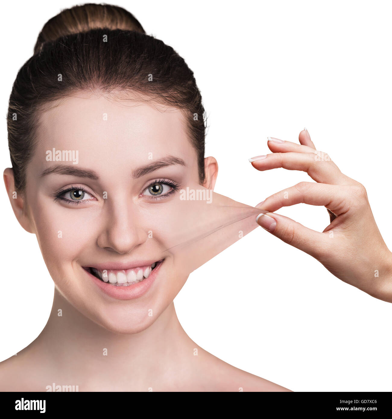Hand pulling skin from cheek of young woman Stock Photo - Alamy