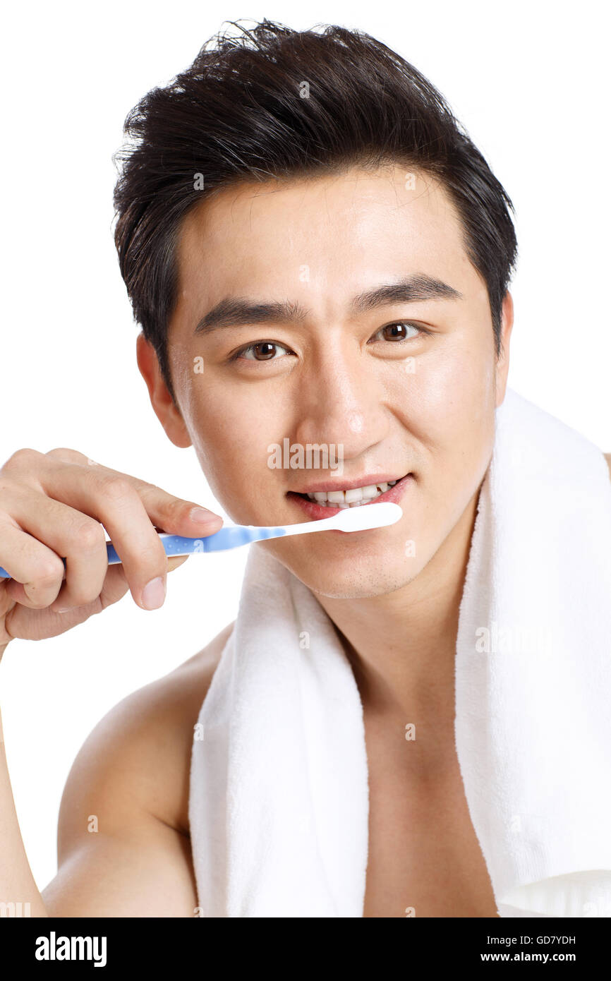 Young men are brushing his teeth Stock Photo - Alamy