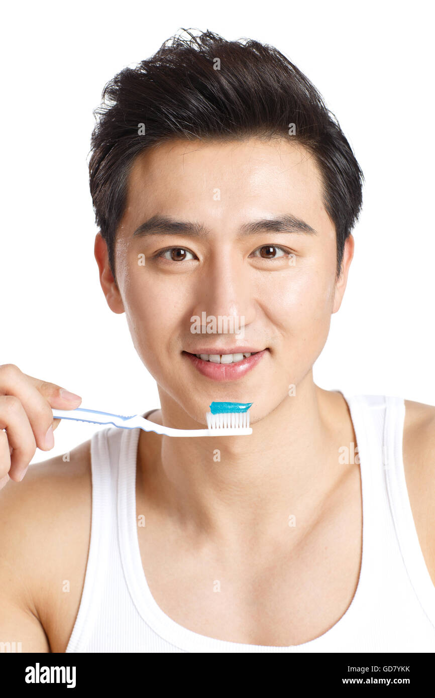 Young men are brushing his teeth Stock Photo - Alamy