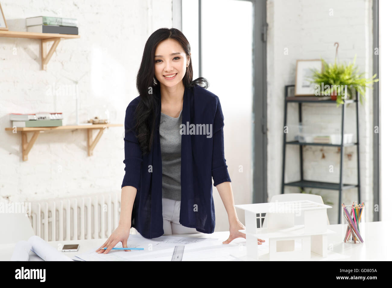 Business woman working in a studio Stock Photo - Alamy