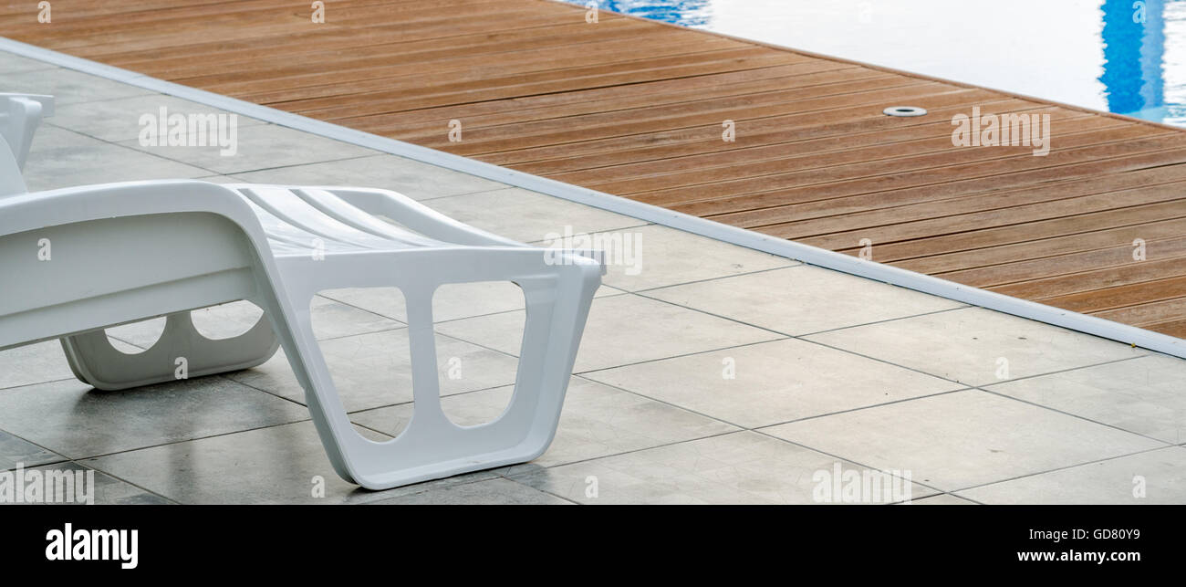 clean swimming pool and empty resting chair Stock Photo - Alamy