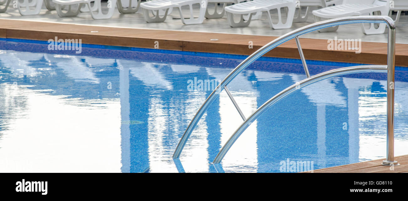 clean swimming pool and empty resting chair Stock Photo - Alamy