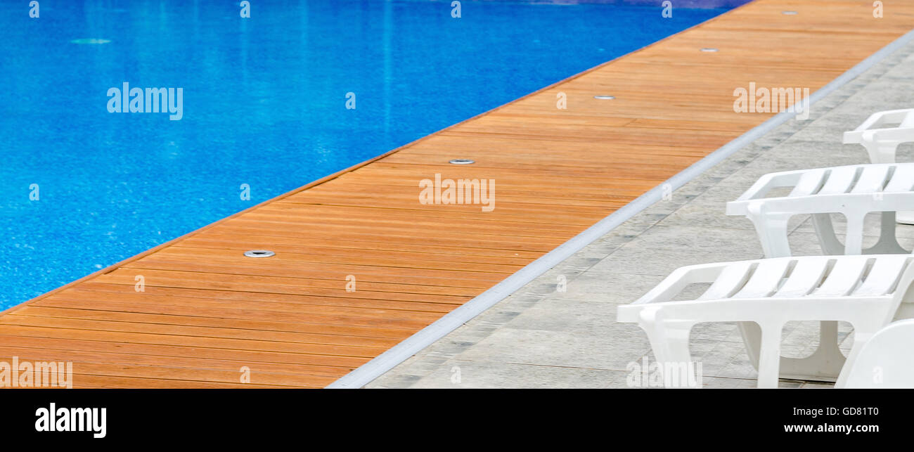 clean swimming pool and empty resting chair Stock Photo - Alamy