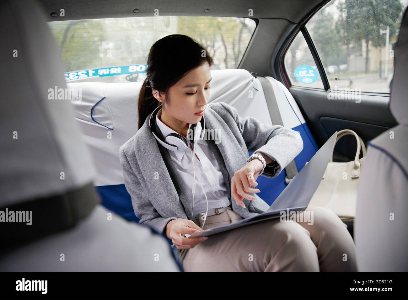 Young women work in a taxi Stock Photo - Alamy