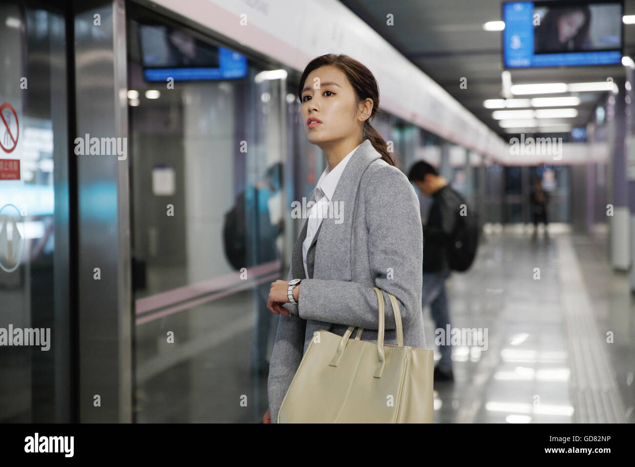 Young women take the subway Stock Photo - Alamy