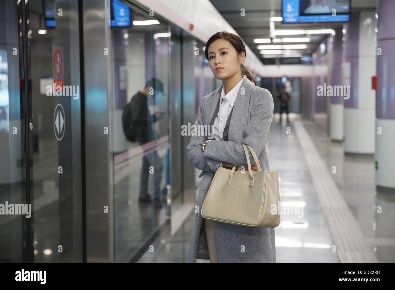 Young women take the subway Stock Photo - Alamy