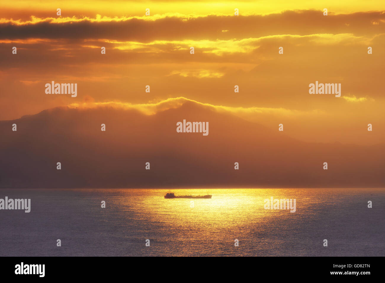 shipping vessel at the sunset Stock Photo - Alamy