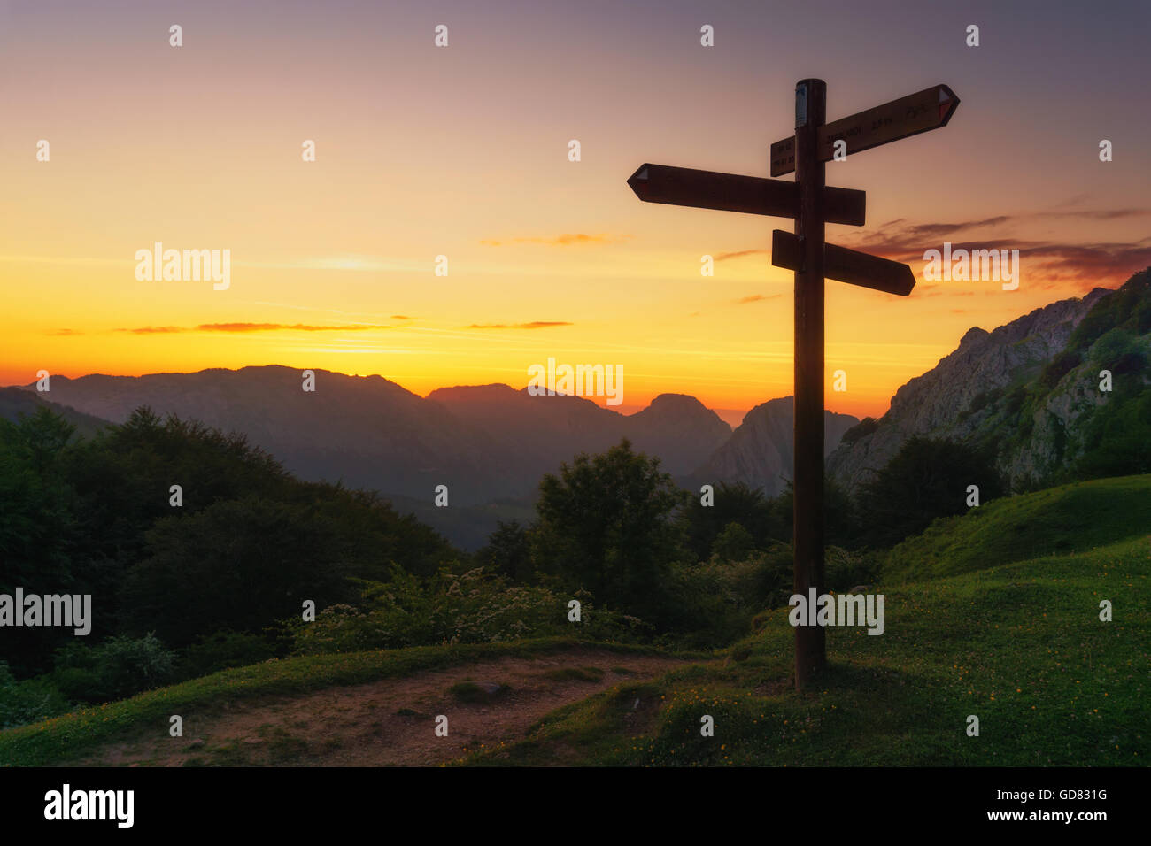 signpost in the mountain at the sunset Stock Photo - Alamy