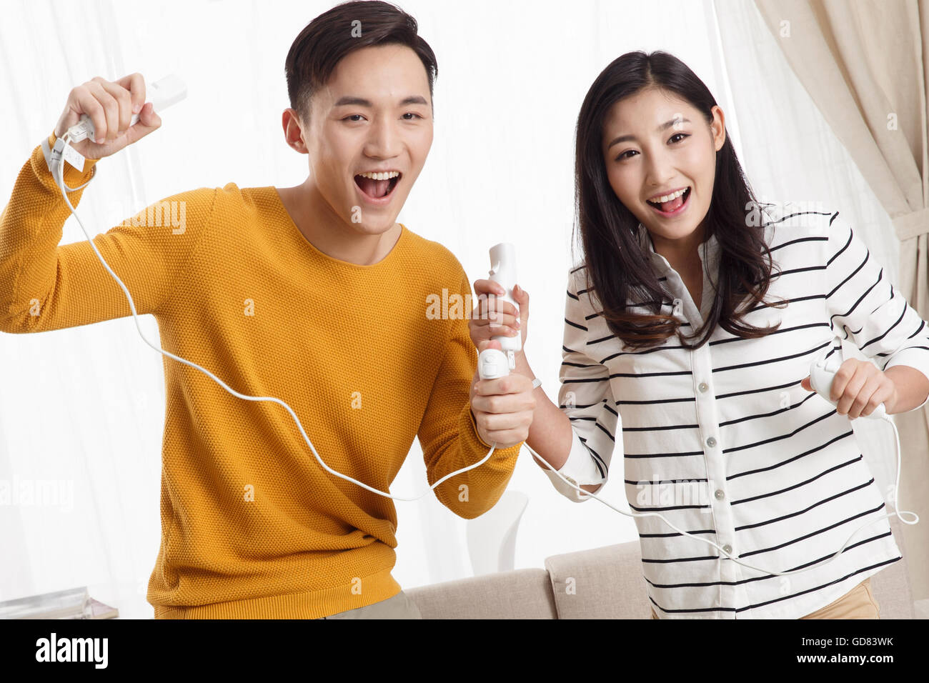 Young lovers play games Stock Photo - Alamy