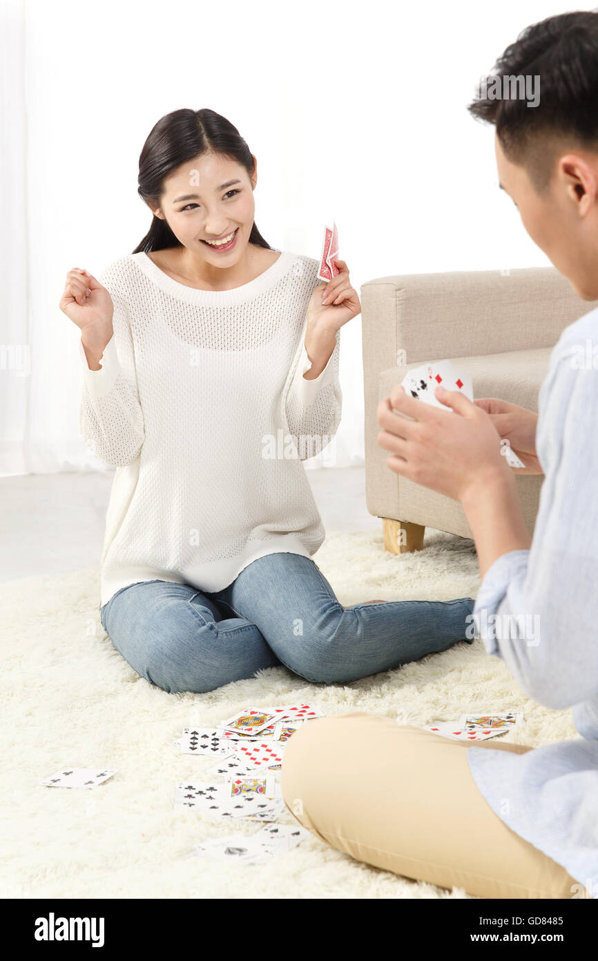 Young lovers playing cards Stock Photo - Alamy