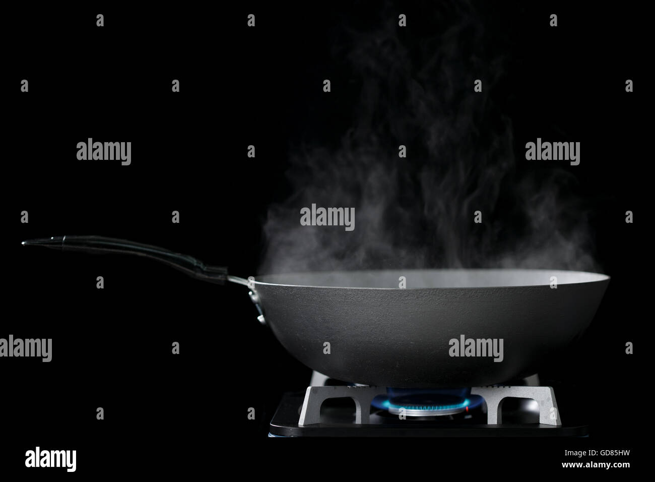 Kitchen burning gas and frying pan Stock Photo - Alamy