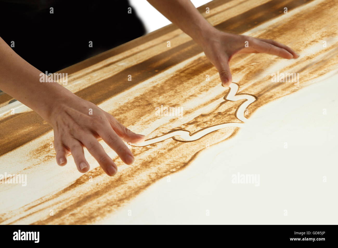 Sand painting creative Stock Photo - Alamy