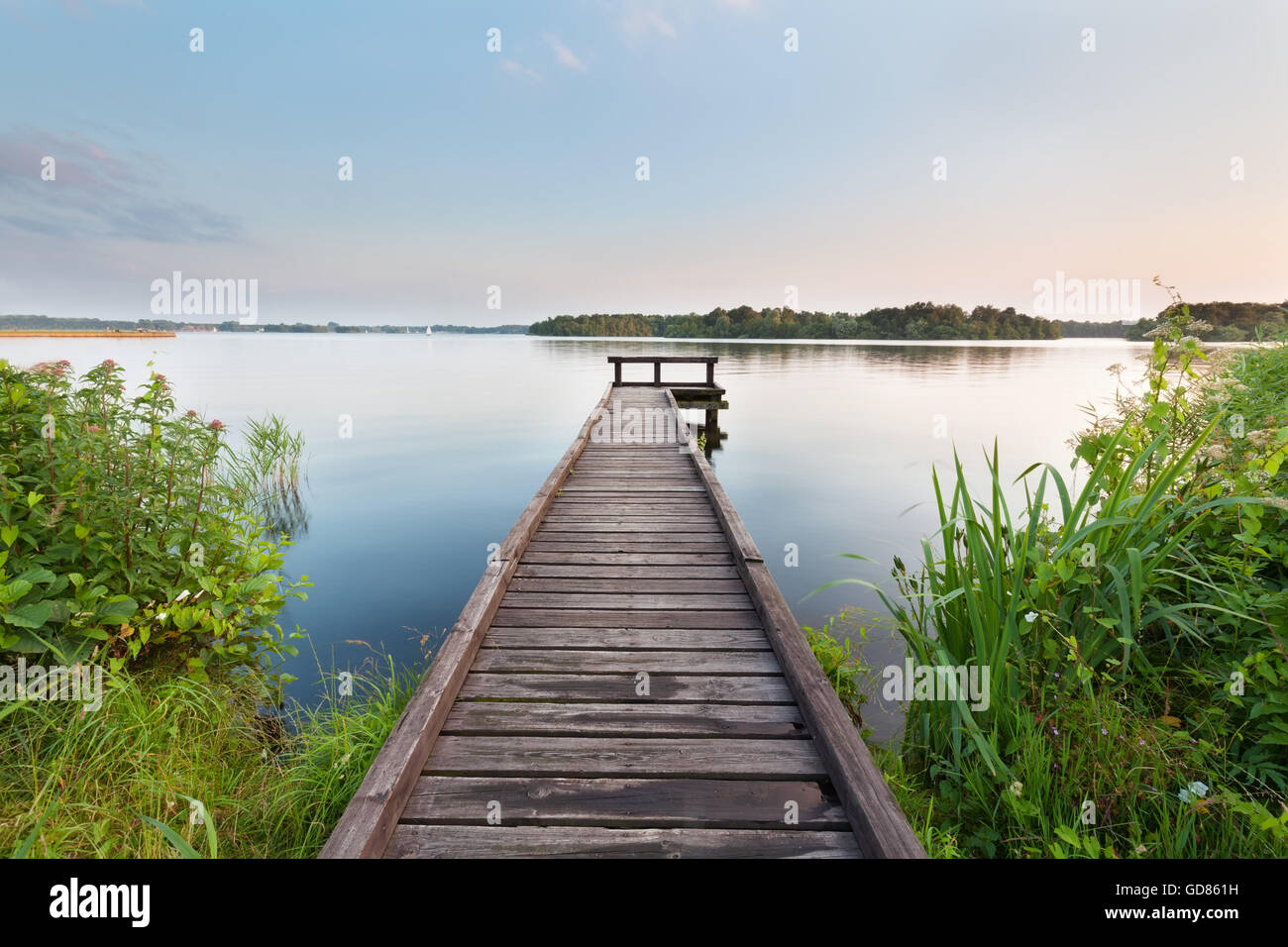 long pier on lake and blue sky in summer Stock Photo - Alamy