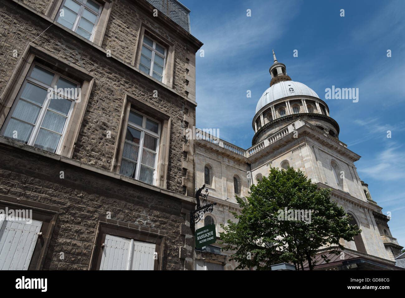The dome of La Basilique Notre-Dame against a bright blue sky. Boulogne ...
