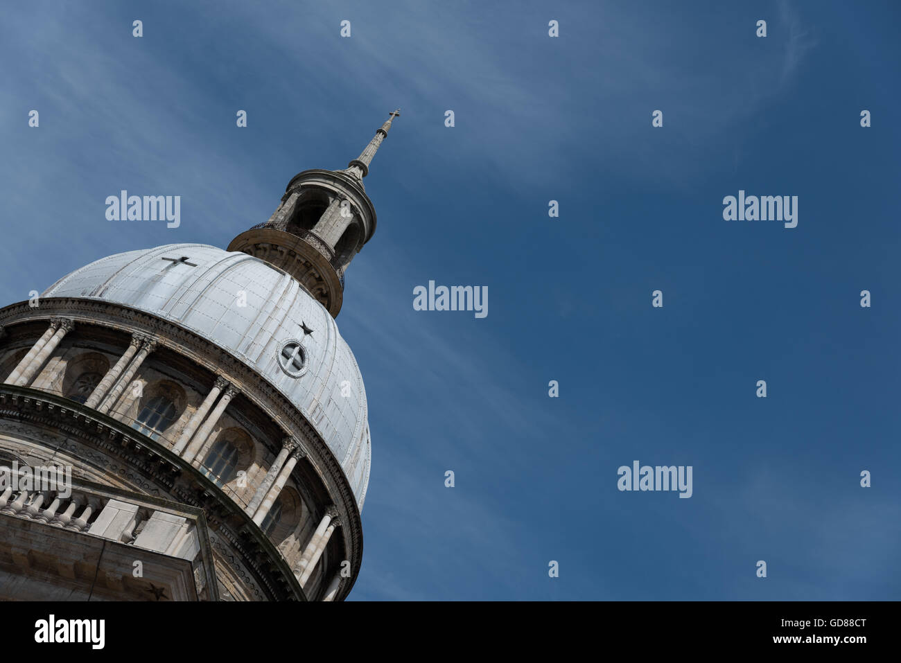 The dome of La Basilique Notre-Dame against a bright blue sky. Boulogne ...