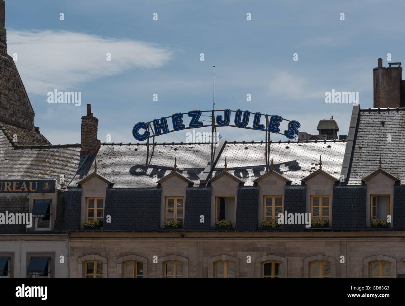 The rooftop and signage for the 'Chez Jules' restaurant, caught in late ...