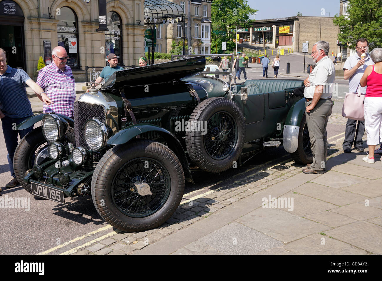 People admiring vintage Bentley car in Buxton Derbyshire England Stock ...