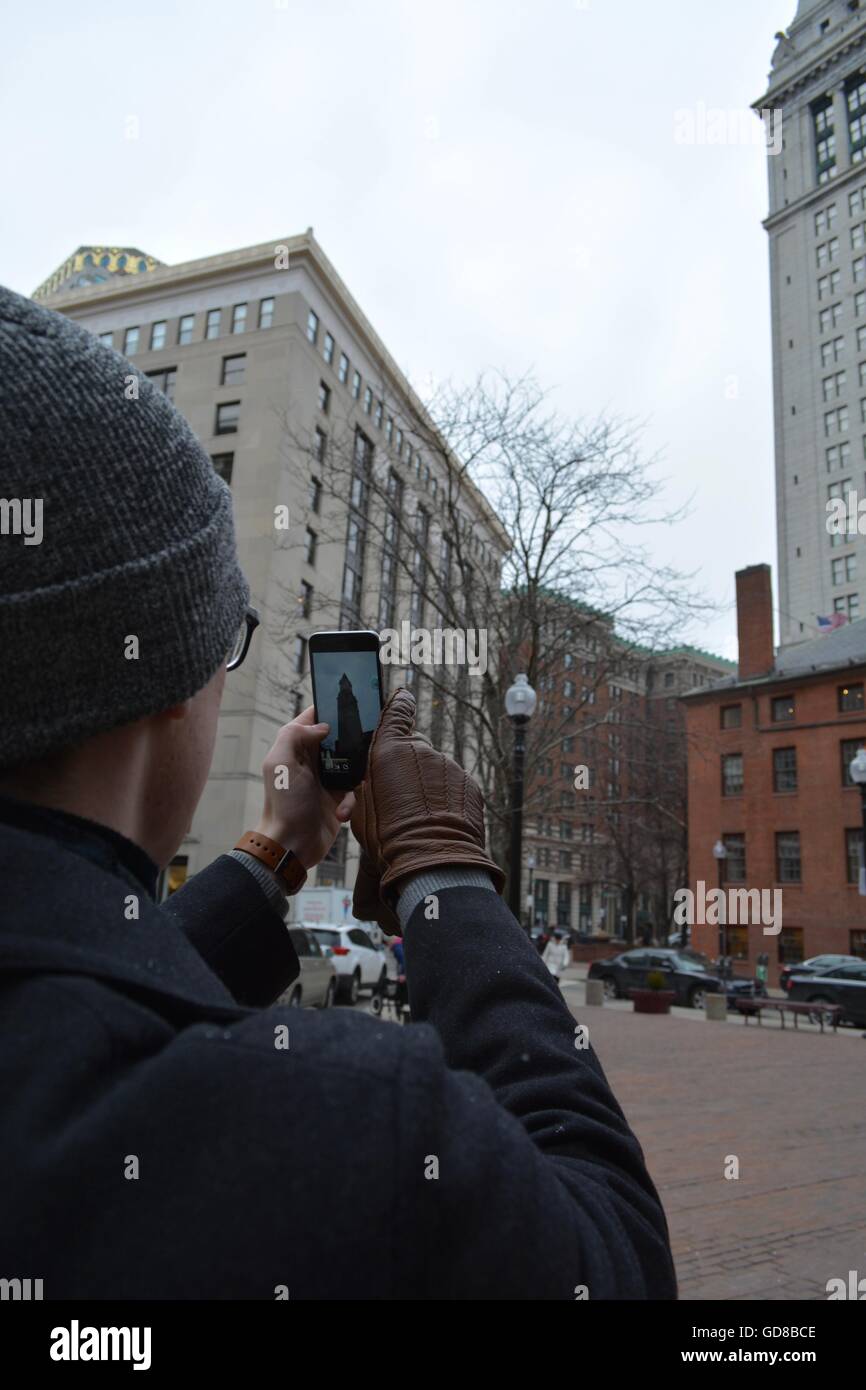 A man taking a photo of a building Stock Photo - Alamy