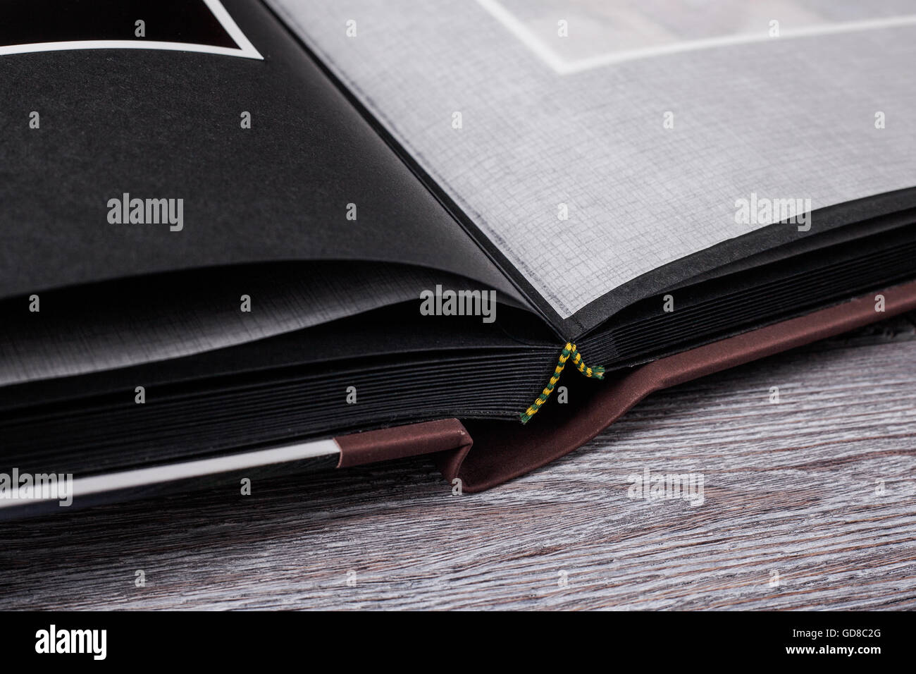 Closeup of opened photobook pages. Education concept Stock Photo - Alamy