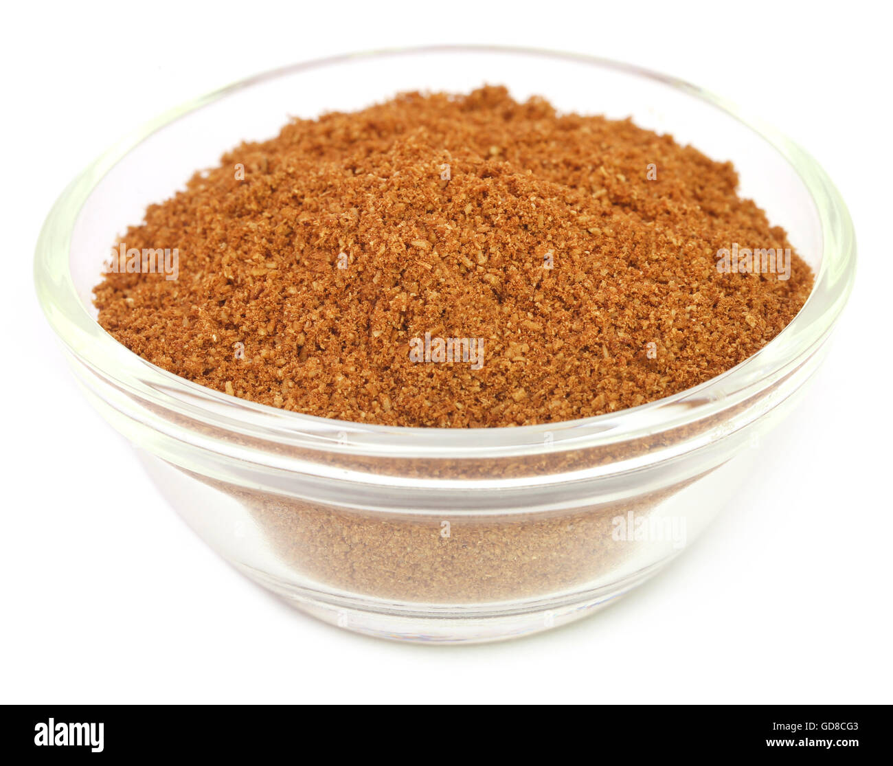 Crushed cumin in a bowl over white background Stock Photo - Alamy