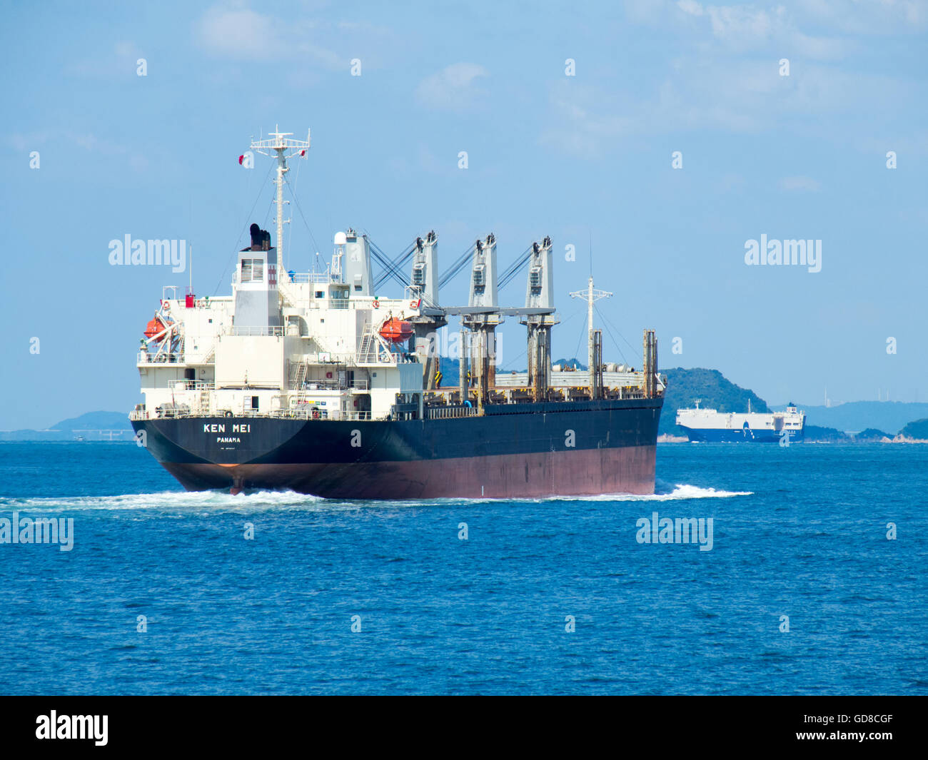 Ken Mei, a bulk carrier ship, traversing the Seto Inland Sea, Japan ...