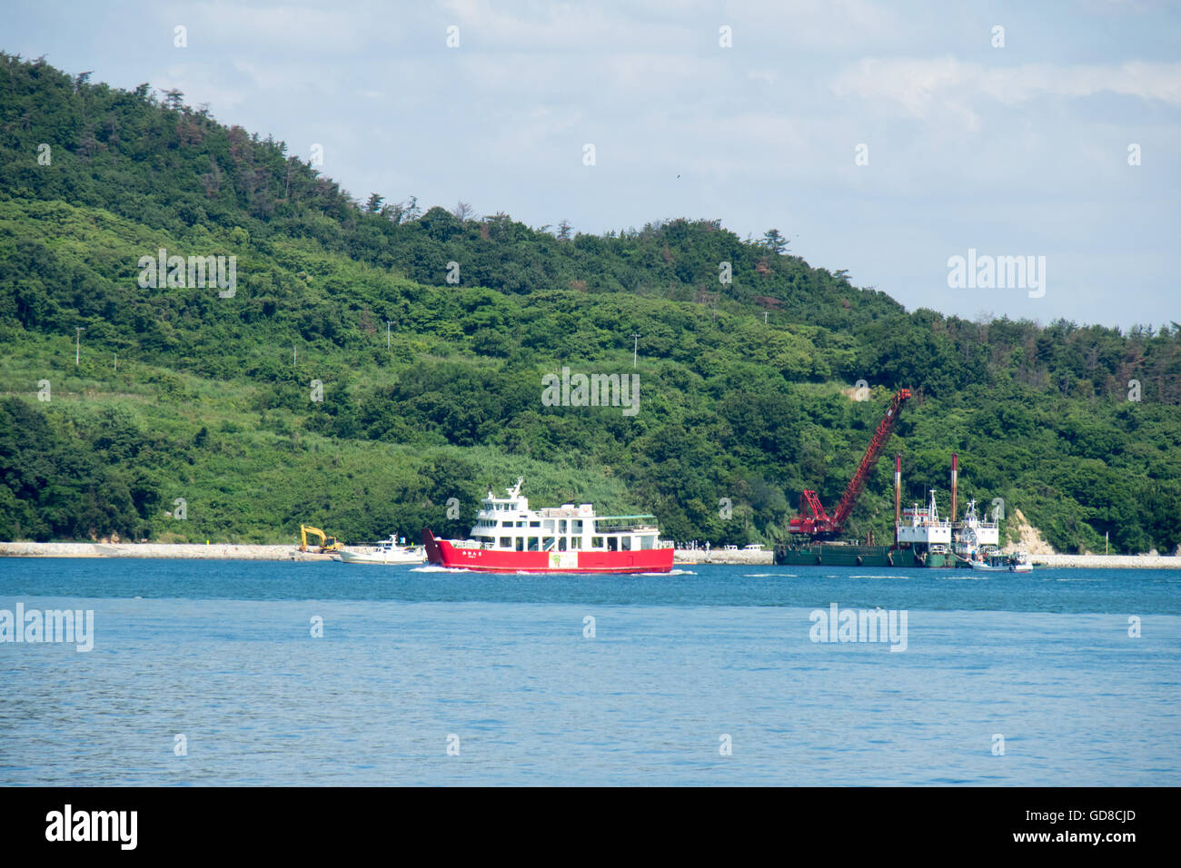 A red ferry and a dredger in the Seto Inland Sea Stock Photo - Alamy