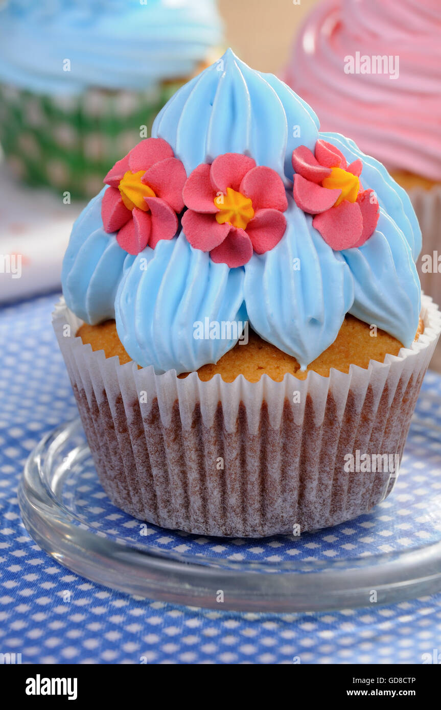 Muffin decorated with a delicate cream closeup Stock Photo - Alamy