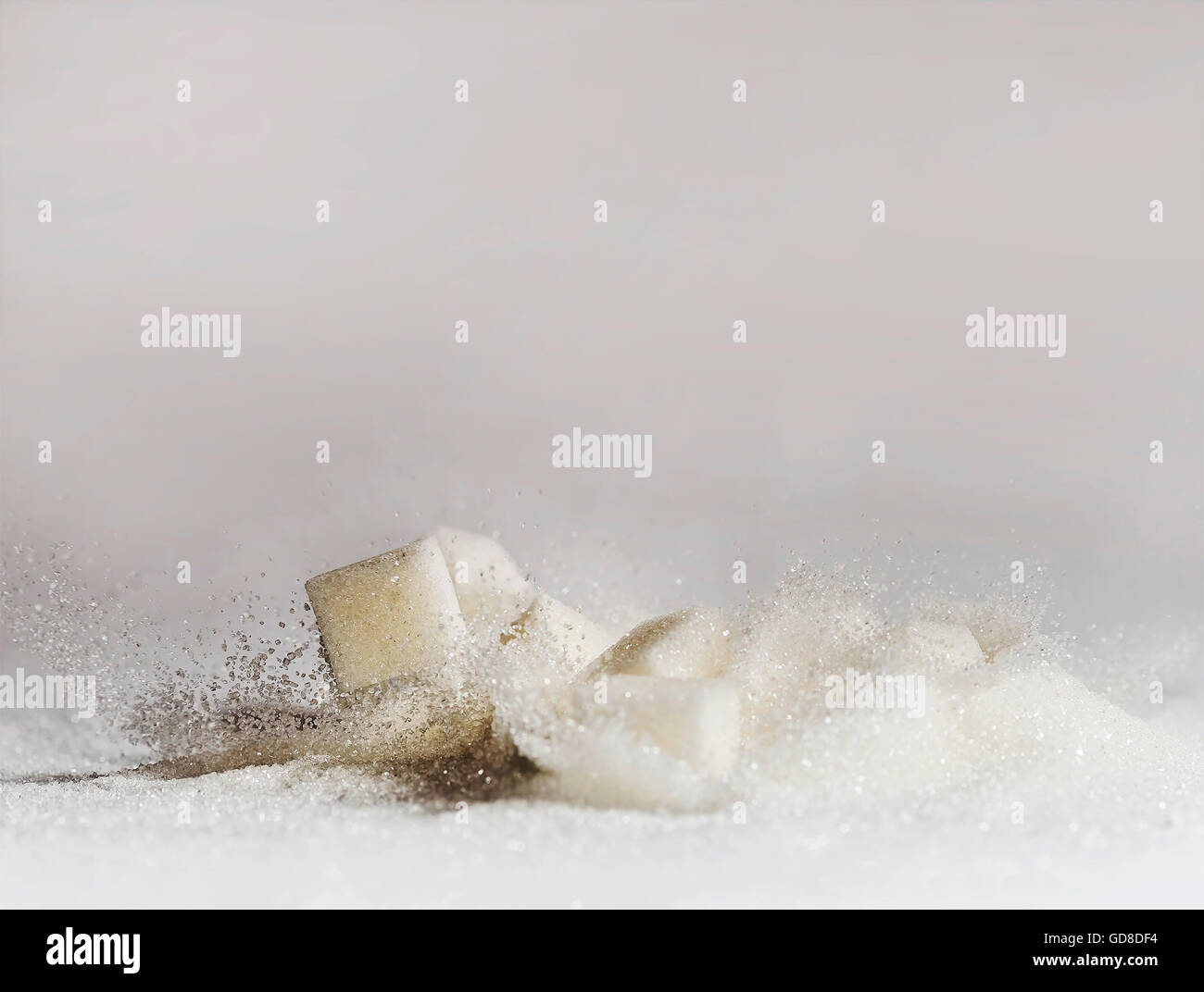 Sugar cube is falling down on a pile of sugar Stock Photo - Alamy