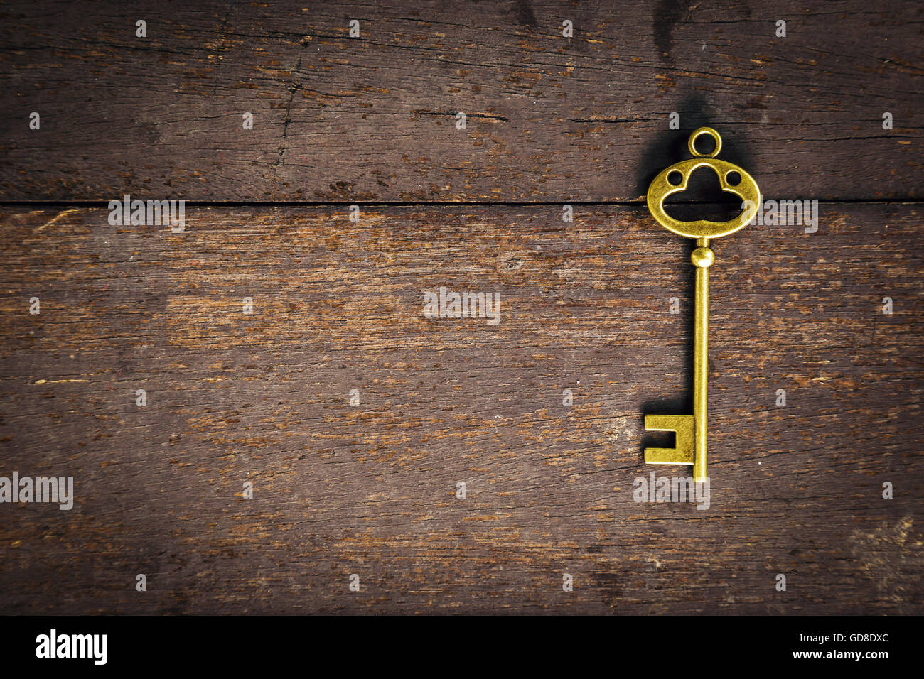Old vintage key on wood texture background with space Stock Photo - Alamy