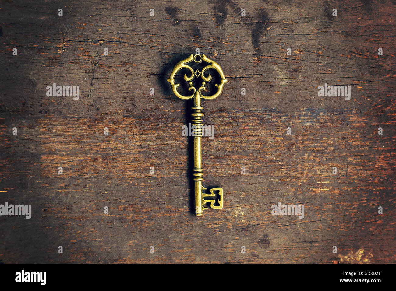 Old vintage key on wood texture background with space Stock Photo - Alamy