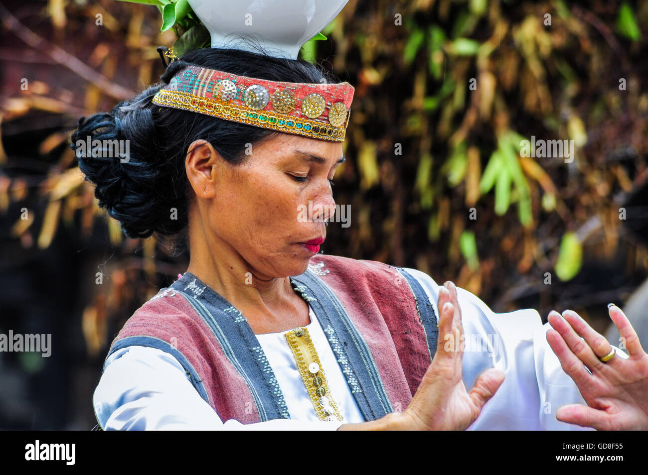 A Traditional Batak Dancer performing a ceremonial dance in Bolon ...
