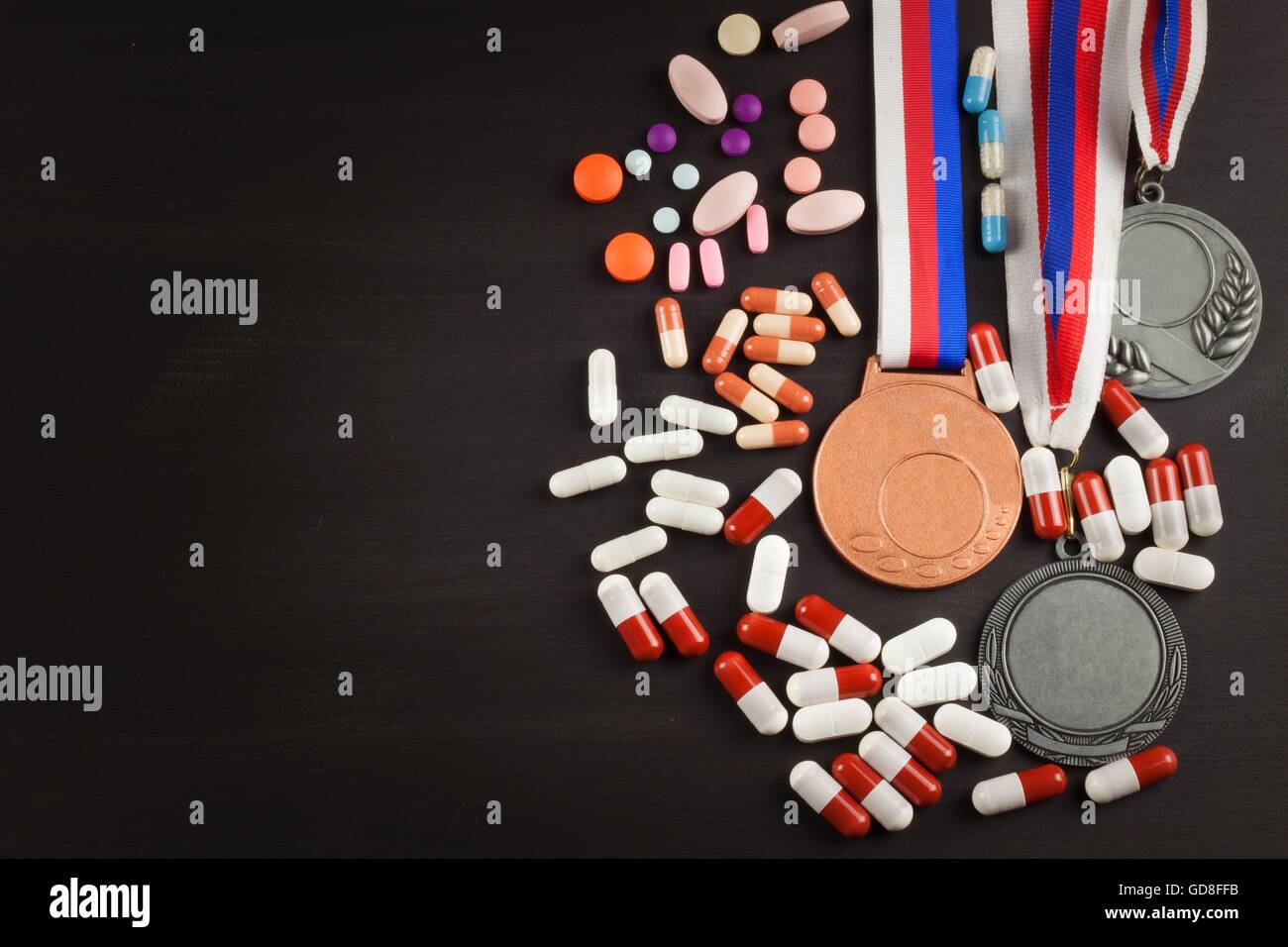 Sports medals on a wooden background. Collection of medals for the ...