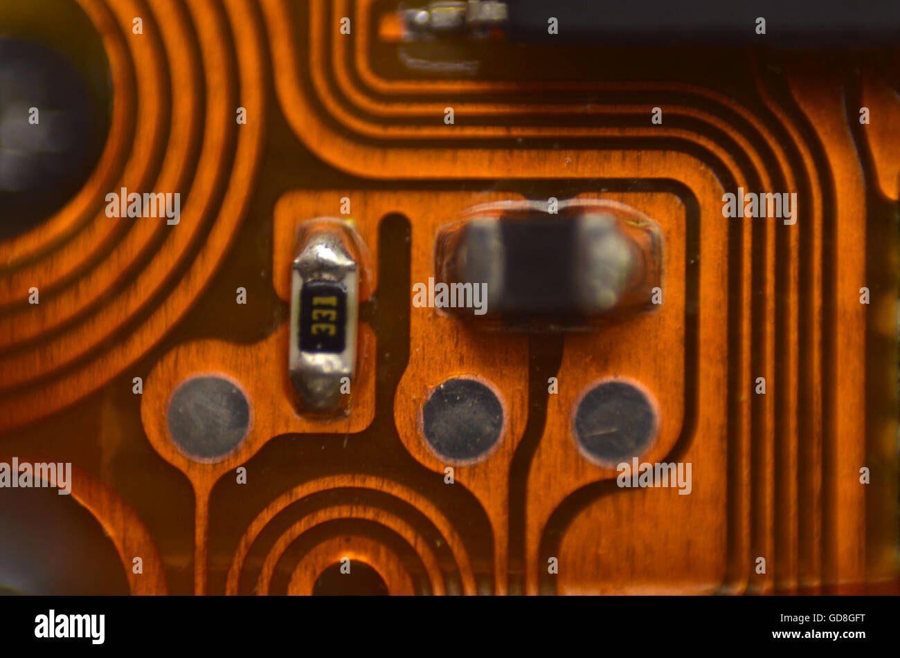 macro photograph inside an early model digital camera circuit board and ...