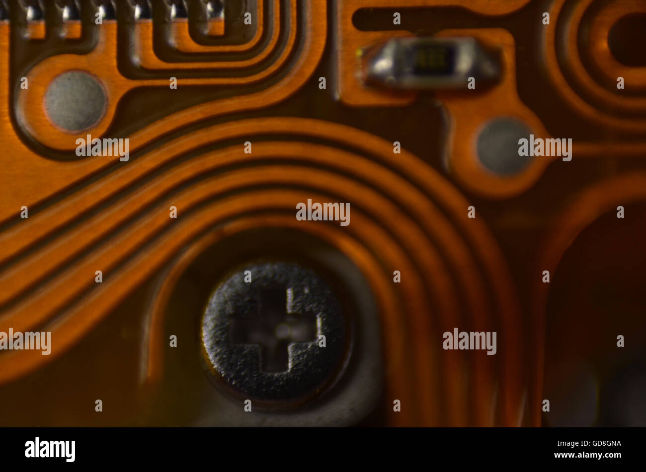 gold color micro electrical circuits inside an early model digital ...