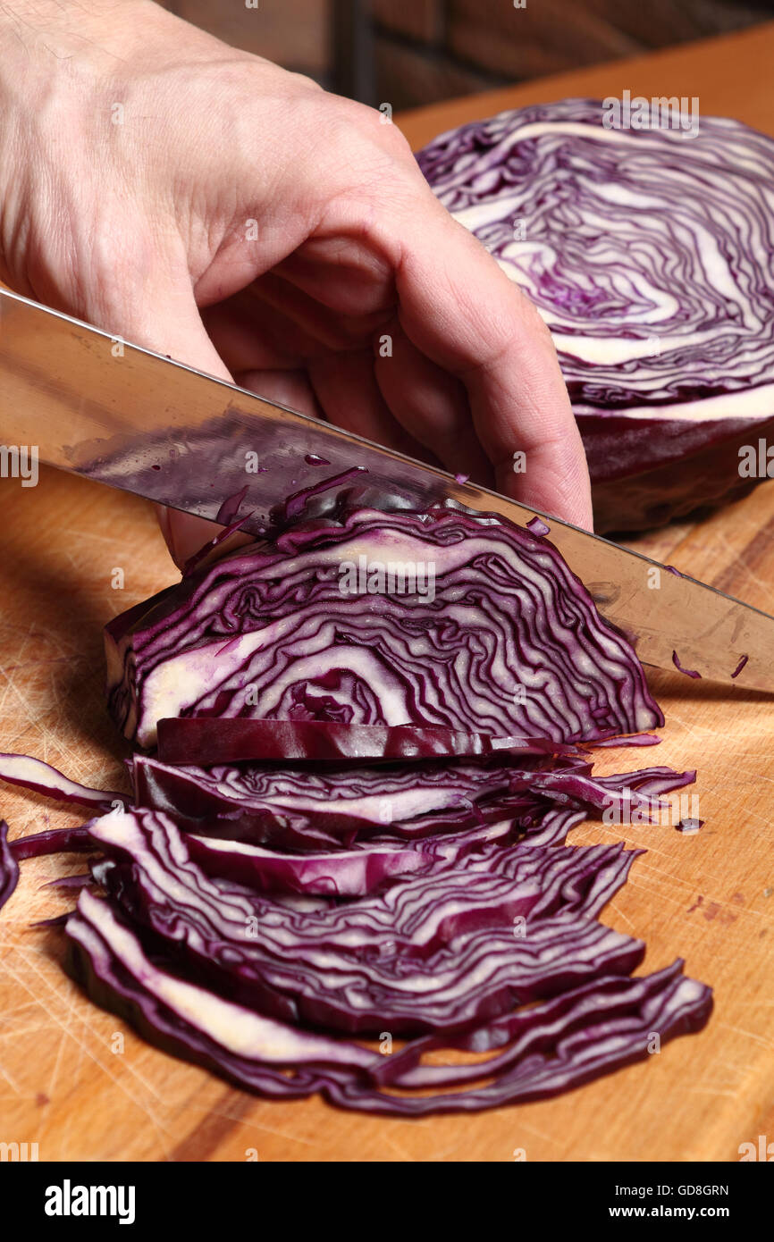 Slicing red purple cabbage Stock Photo - Alamy