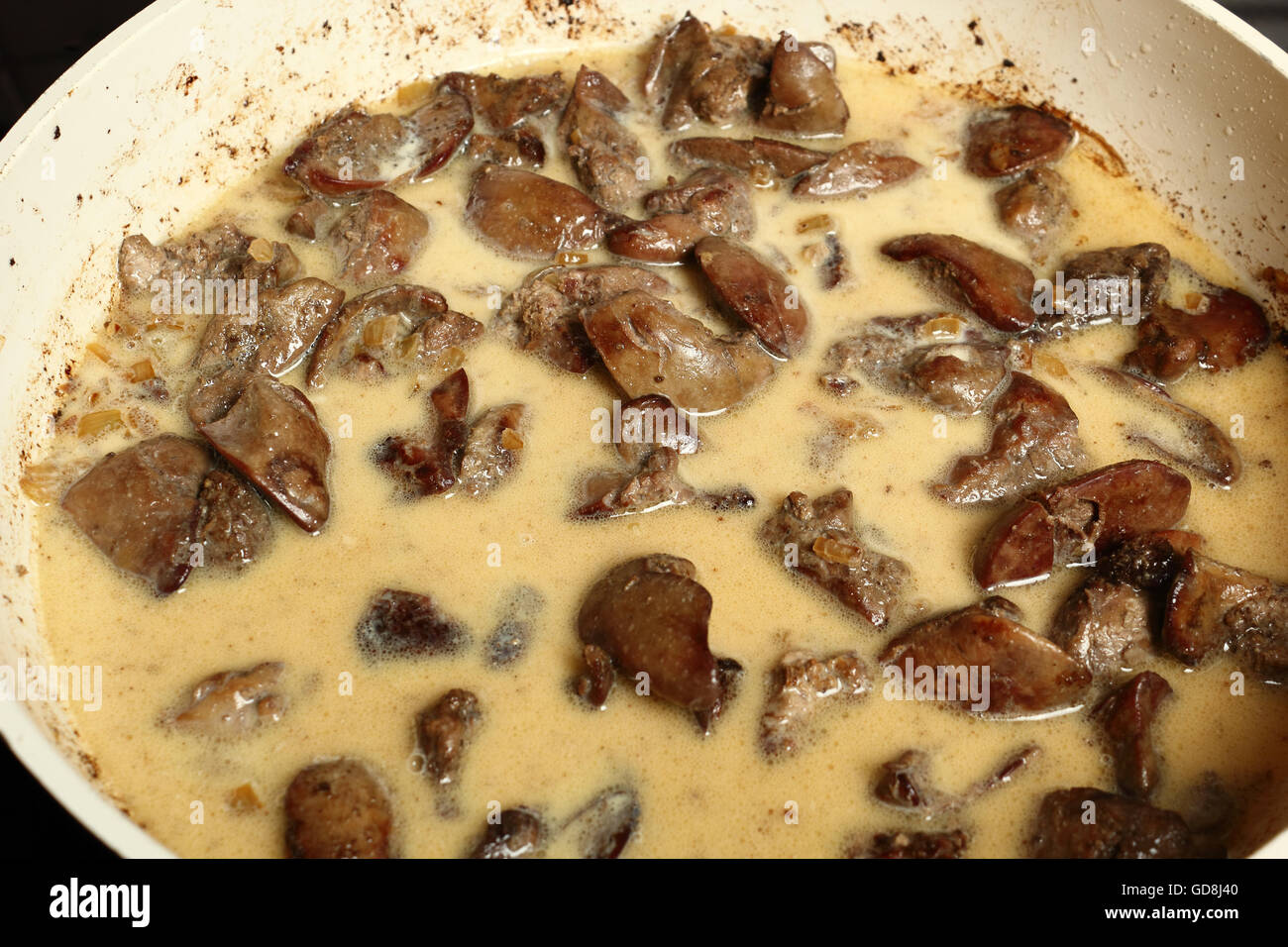 Cooking Chicken Liver. Braising liver with milk Stock Photo - Alamy