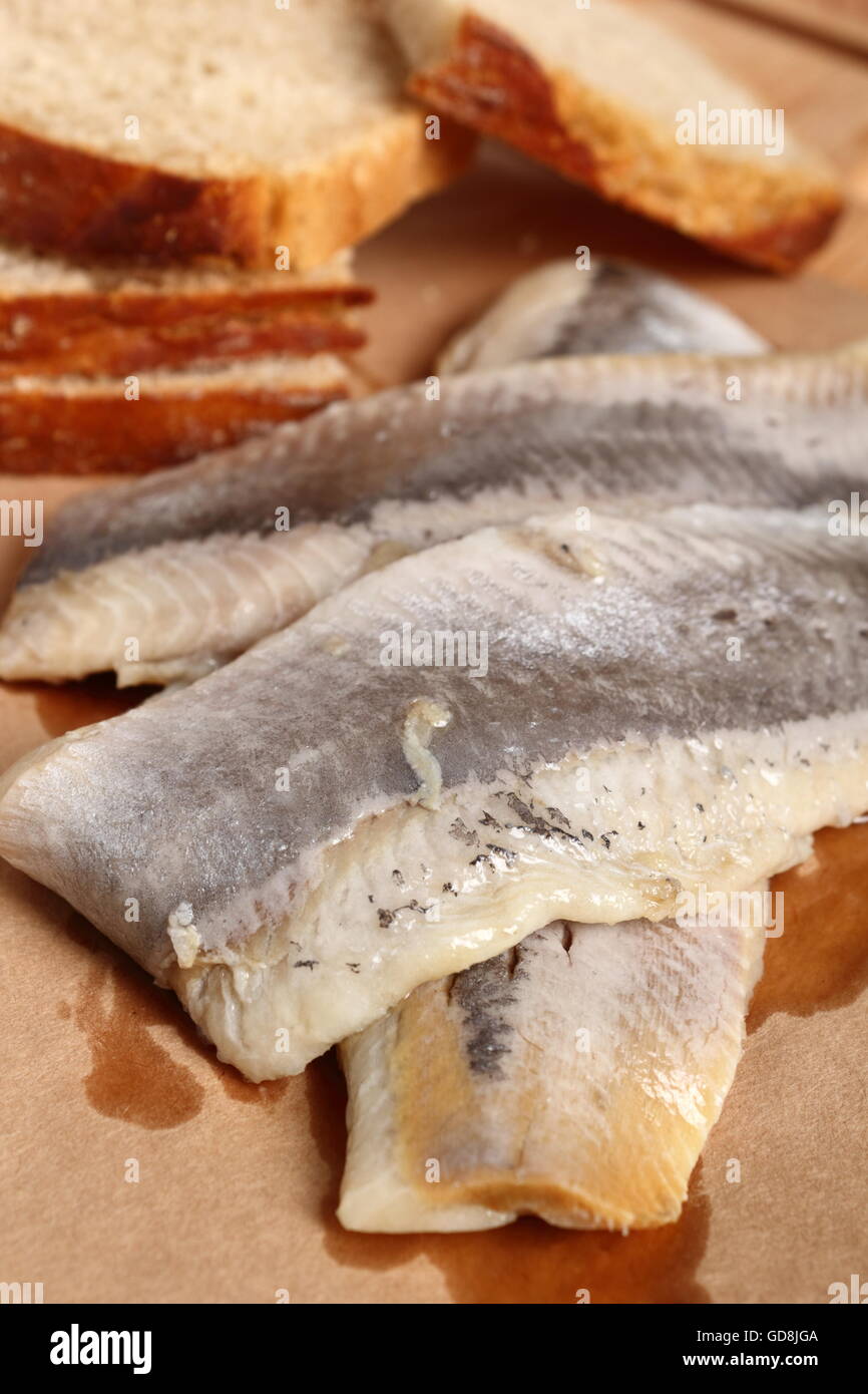 Pickled herring and bread. Salted, soused skinless fillets of fish ...