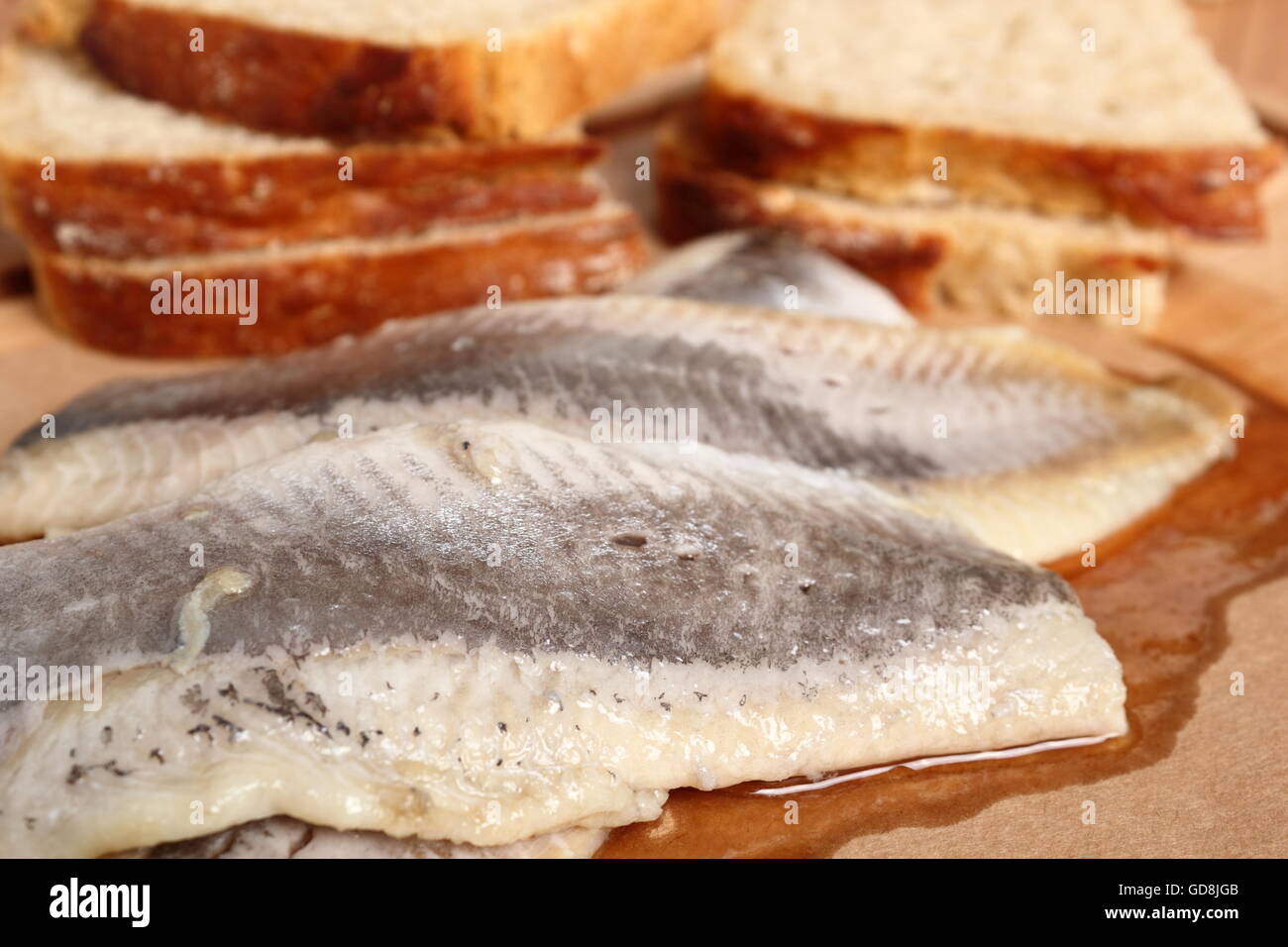 Pickled herring and bread. Salted, soused skinless fillets of fish ...