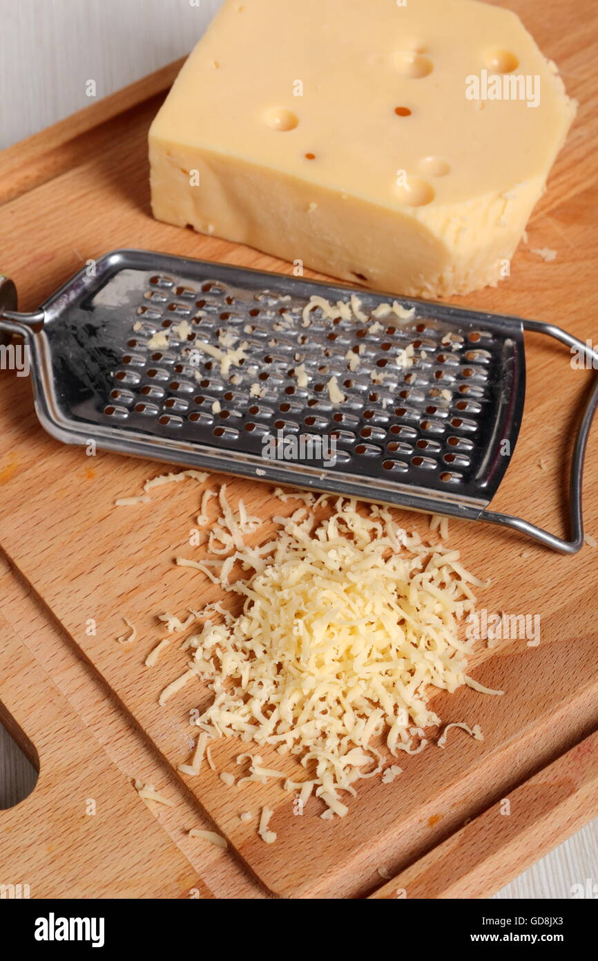 Grated cheese and fine grater Stock Photo - Alamy