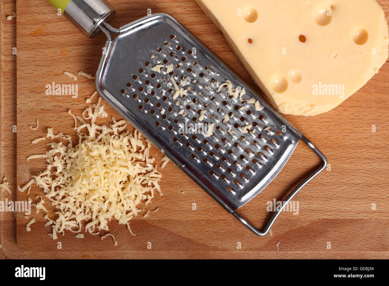 Grated cheese and fine grater Stock Photo - Alamy