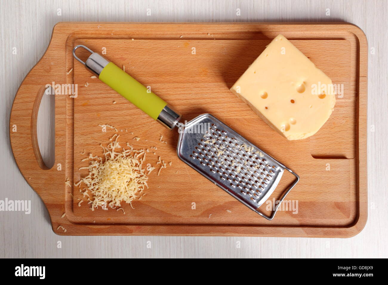 Grated cheese and fine grater Stock Photo - Alamy